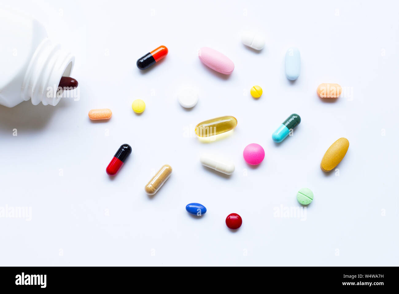 Colorful tablets with capsules and pills on white background Stock ...