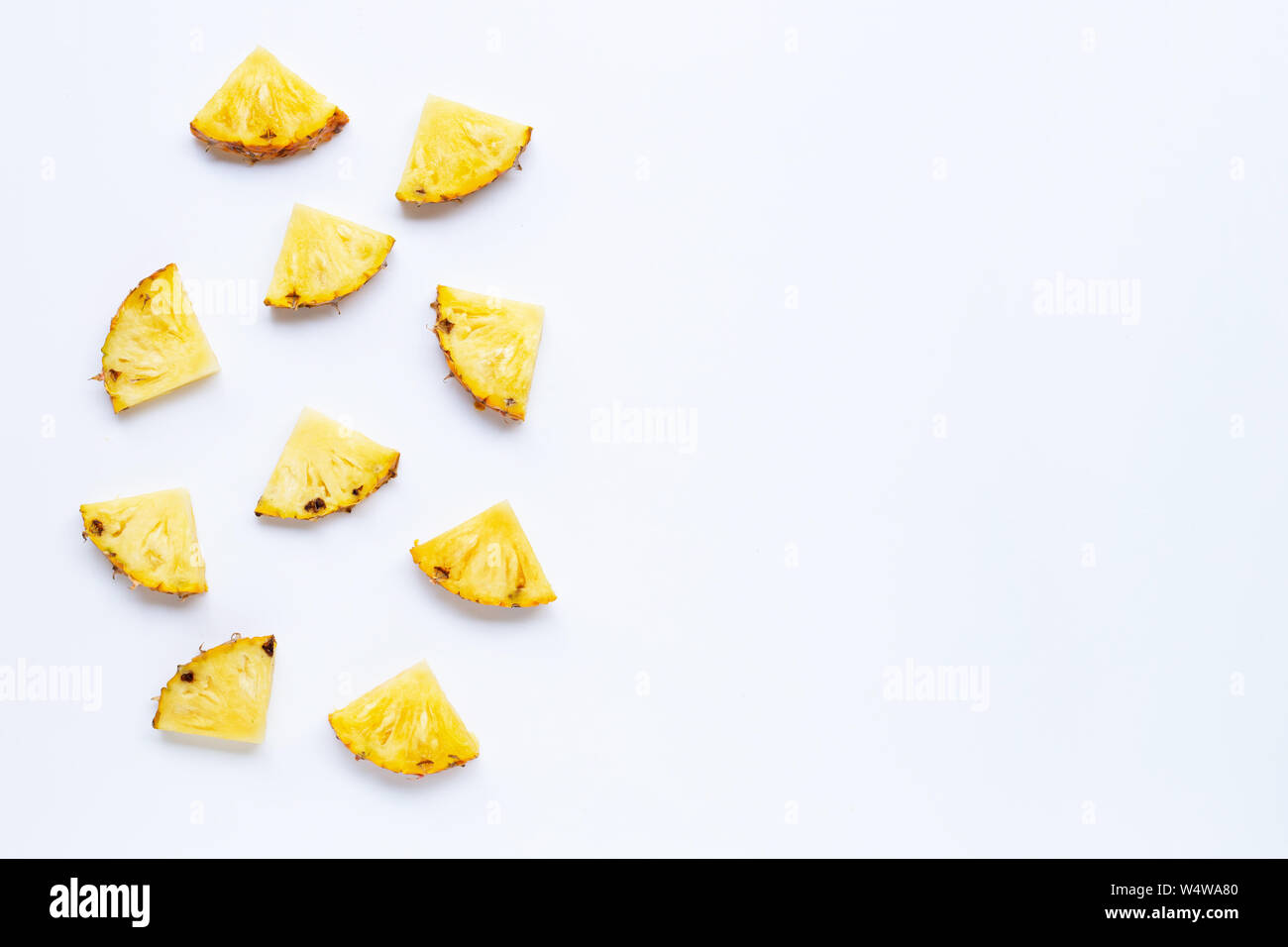 Pineapple slices on white background Stock Photo - Alamy