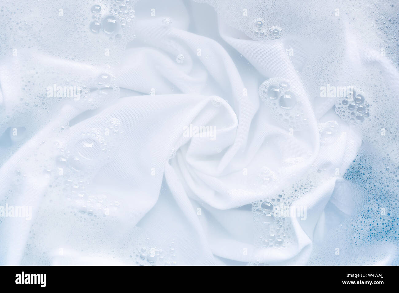 Soak a cloth before washing, white cloth. Top view Stock Photo - Alamy