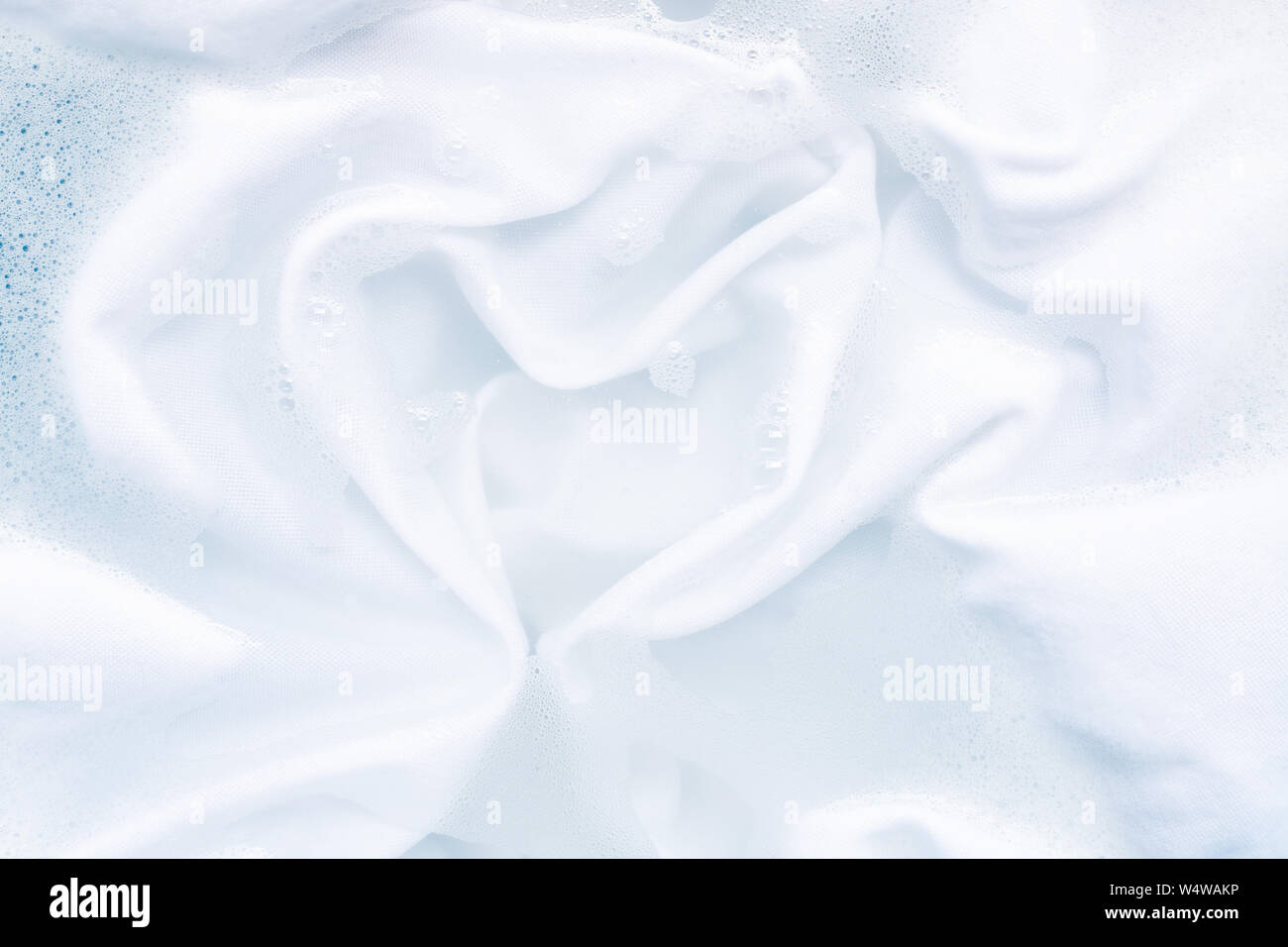 Soak a cloth before washing, white cloth. Top view Stock Photo - Alamy