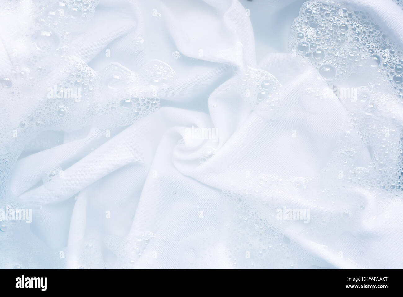 Soak a cloth before washing, white cloth. Top view Stock Photo - Alamy