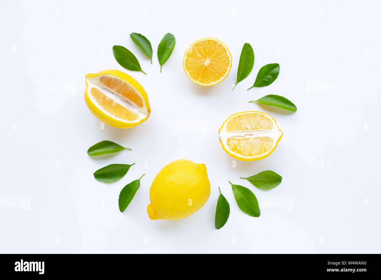 Lemon and slices with leaves isolated on white background Stock Photo ...