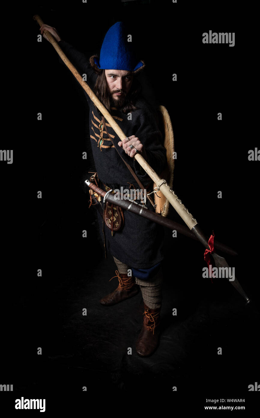 slavic warrior in a costume of the Viking Age holding a spear Stock ...