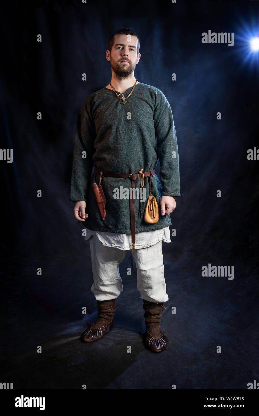 young viking male in casual costume of the early medieval era, hobby ...