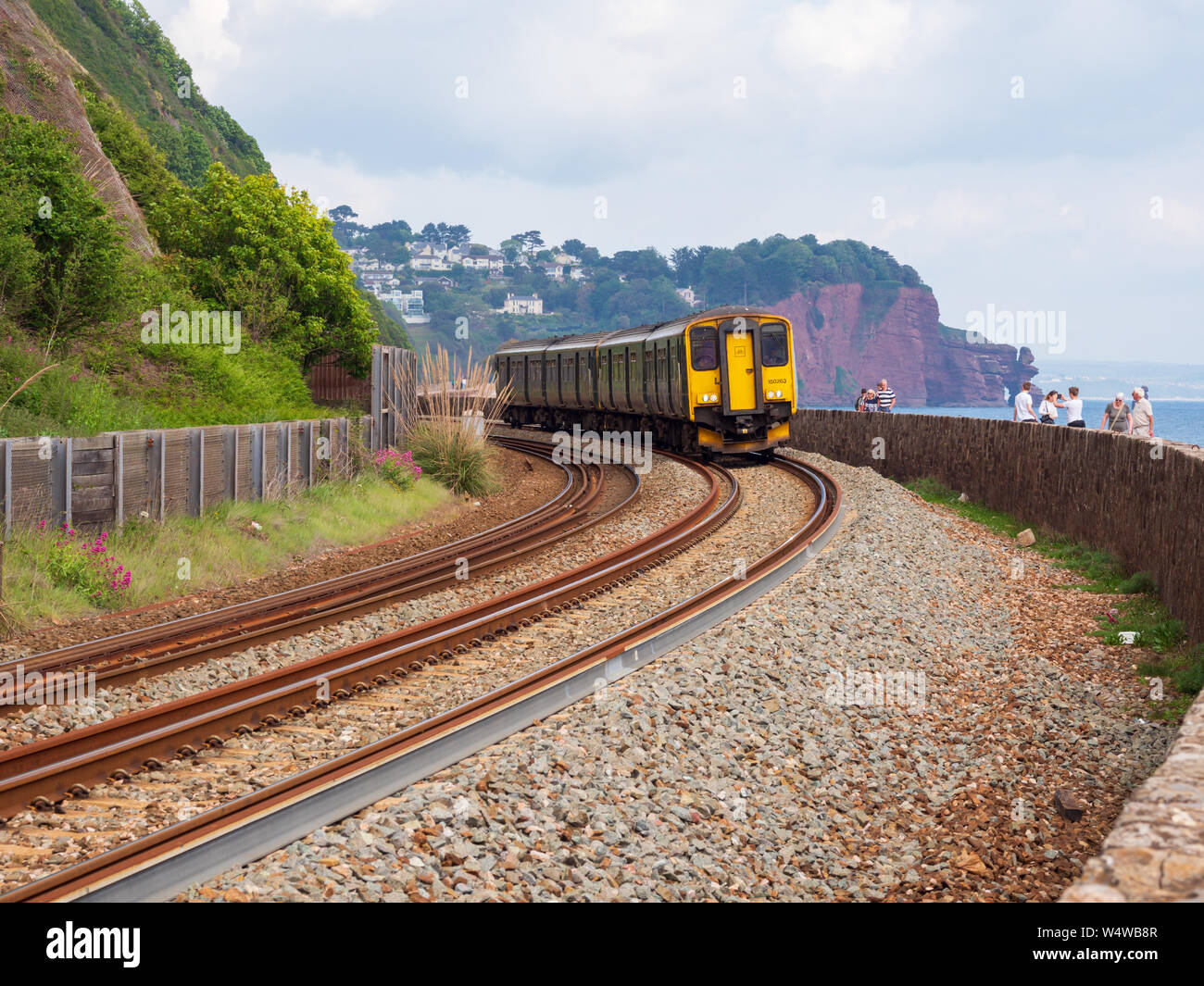 Main Line Railway along the coast at Teignmouth Devon Stock Photo - Alamy