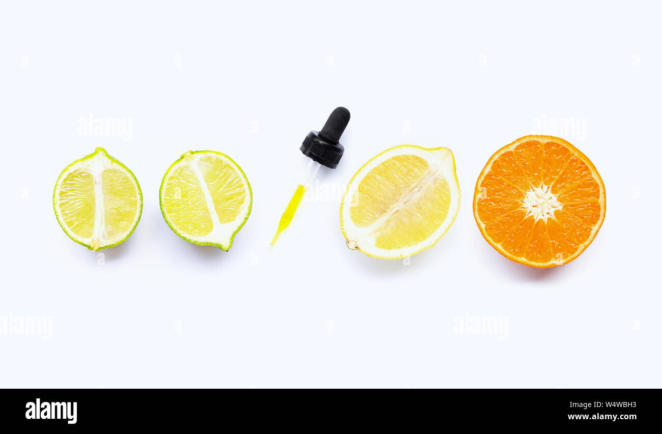 Orange, lime and lemon with dropper on white background Stock Photo - Alamy