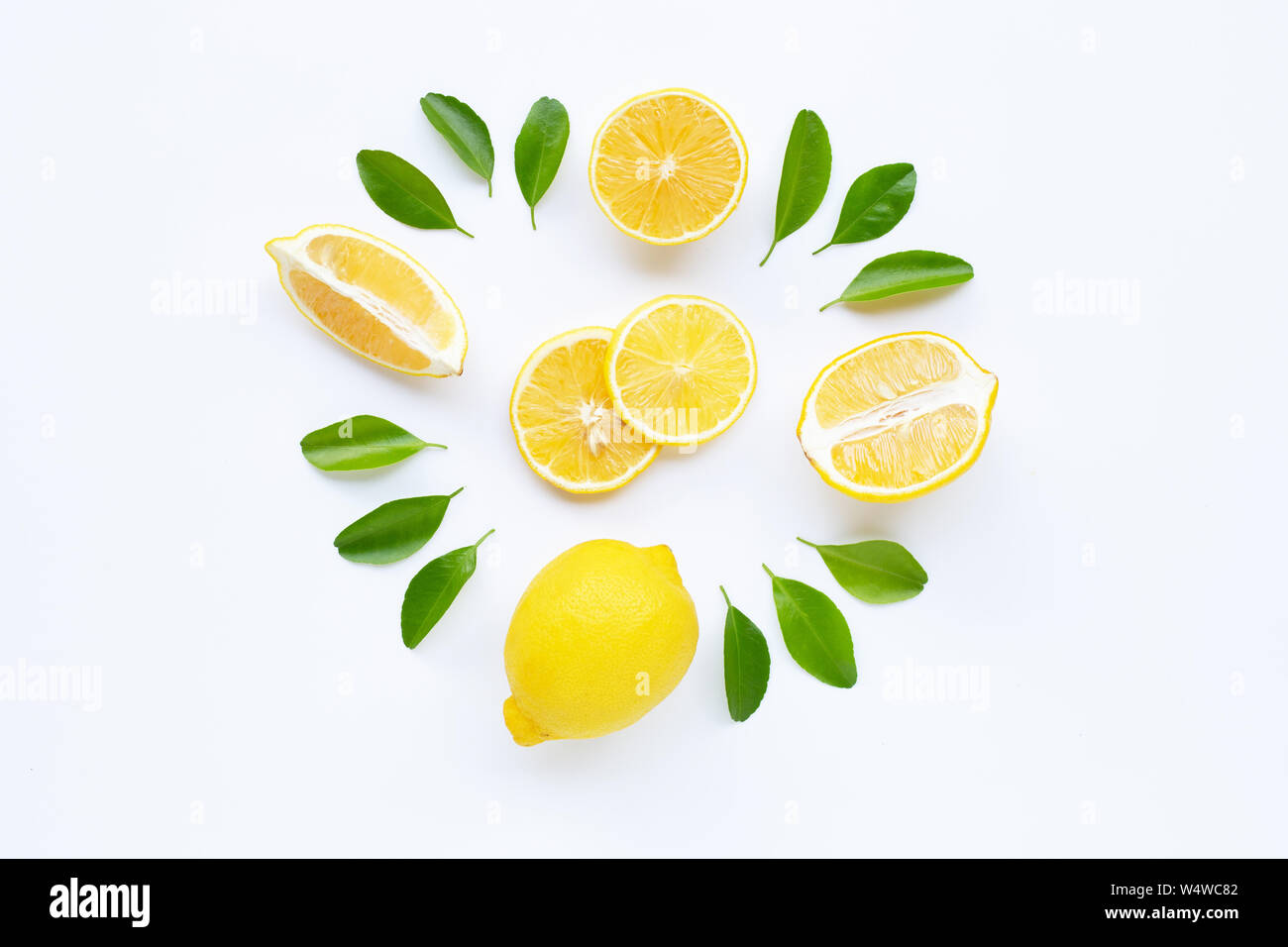 lemon and slices with leaves isolated on white background Stock Photo ...