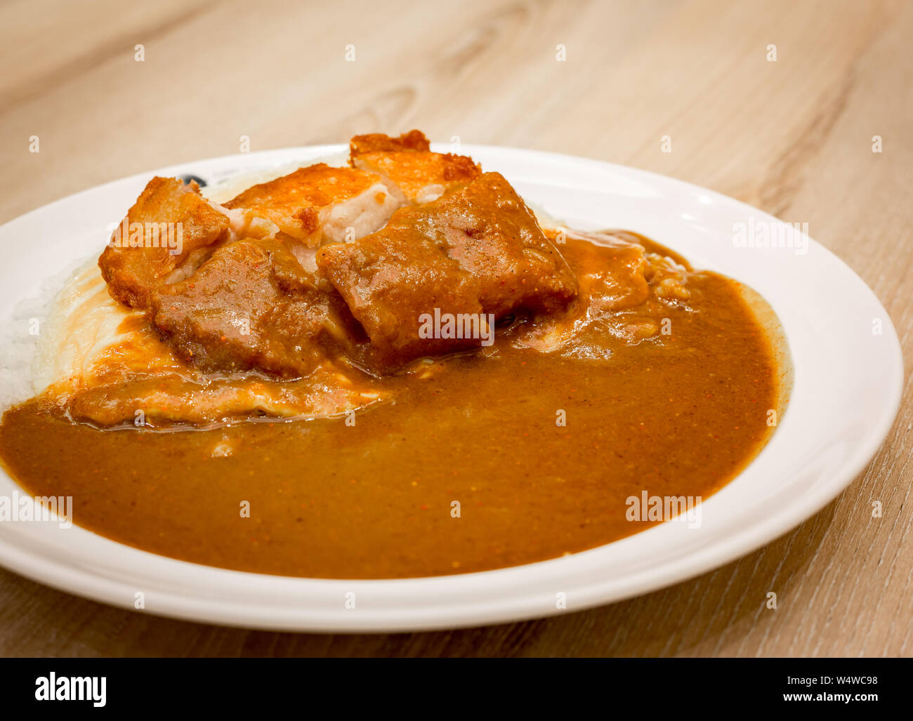 tonkatsu curry rice on wood table Stock Photo - Alamy