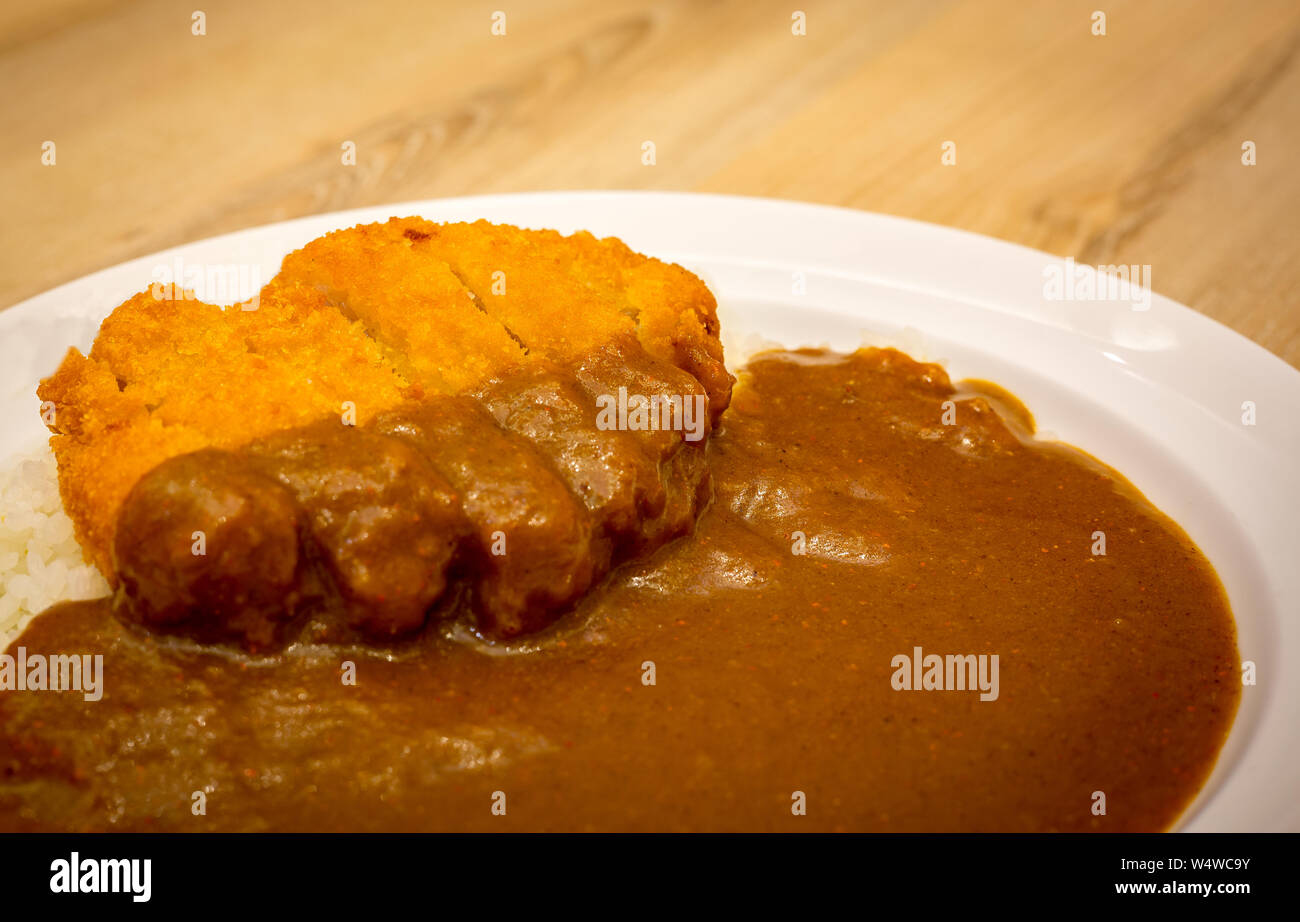 tonkatsu curry rice on wood table Stock Photo - Alamy