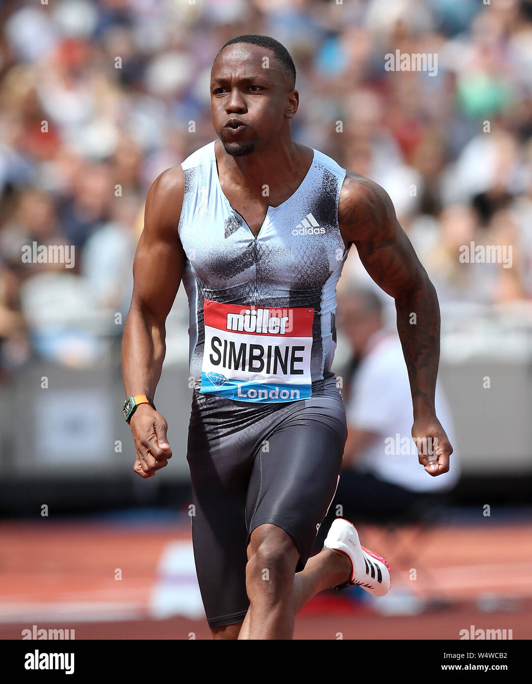 South Africa's Akani Simbine competes in the Men's 100m Stock Photo - Alamy