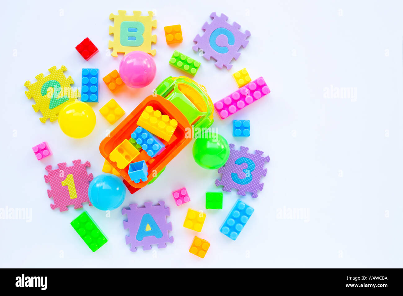 Colorful Kids toys on white background. Copy space Stock Photo - Alamy