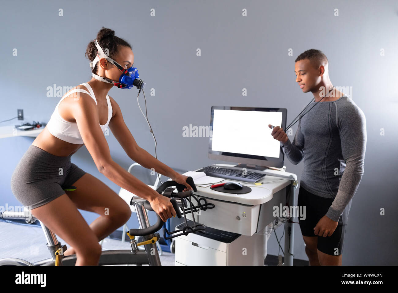 Woman doing a fitness test Stock Photo - Alamy