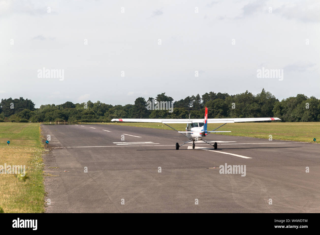 Light aircraft waiting on the runway and ready to take off Stock Photo ...