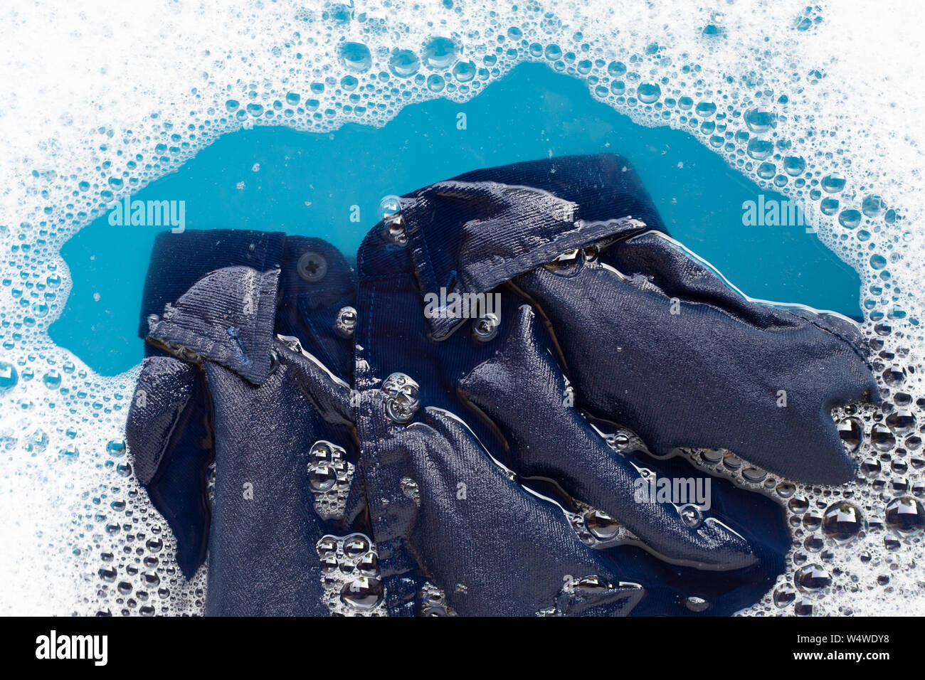 Shirt soak in powder detergent water dissolution, washing cloth ...