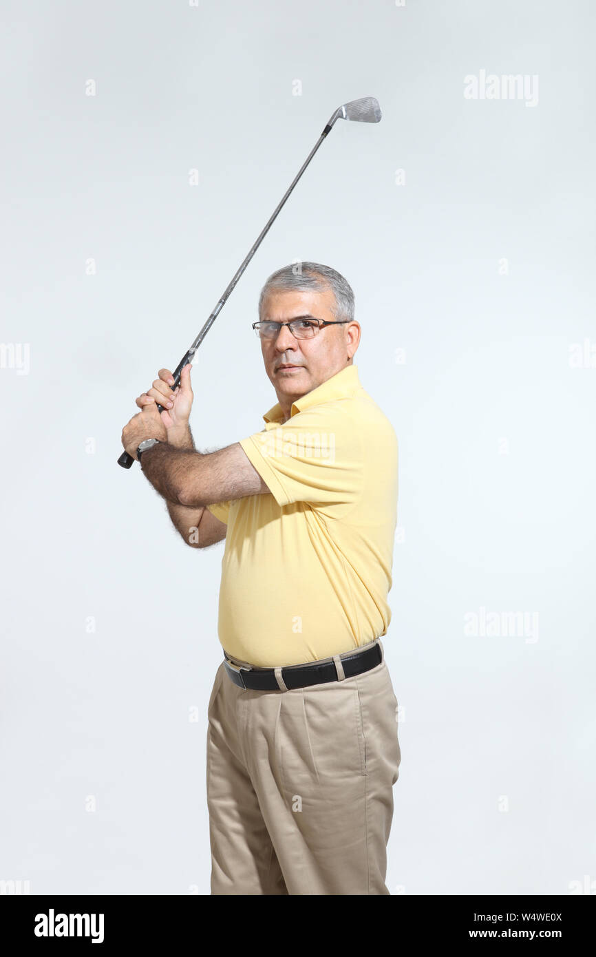 Man playing golf Stock Photo - Alamy