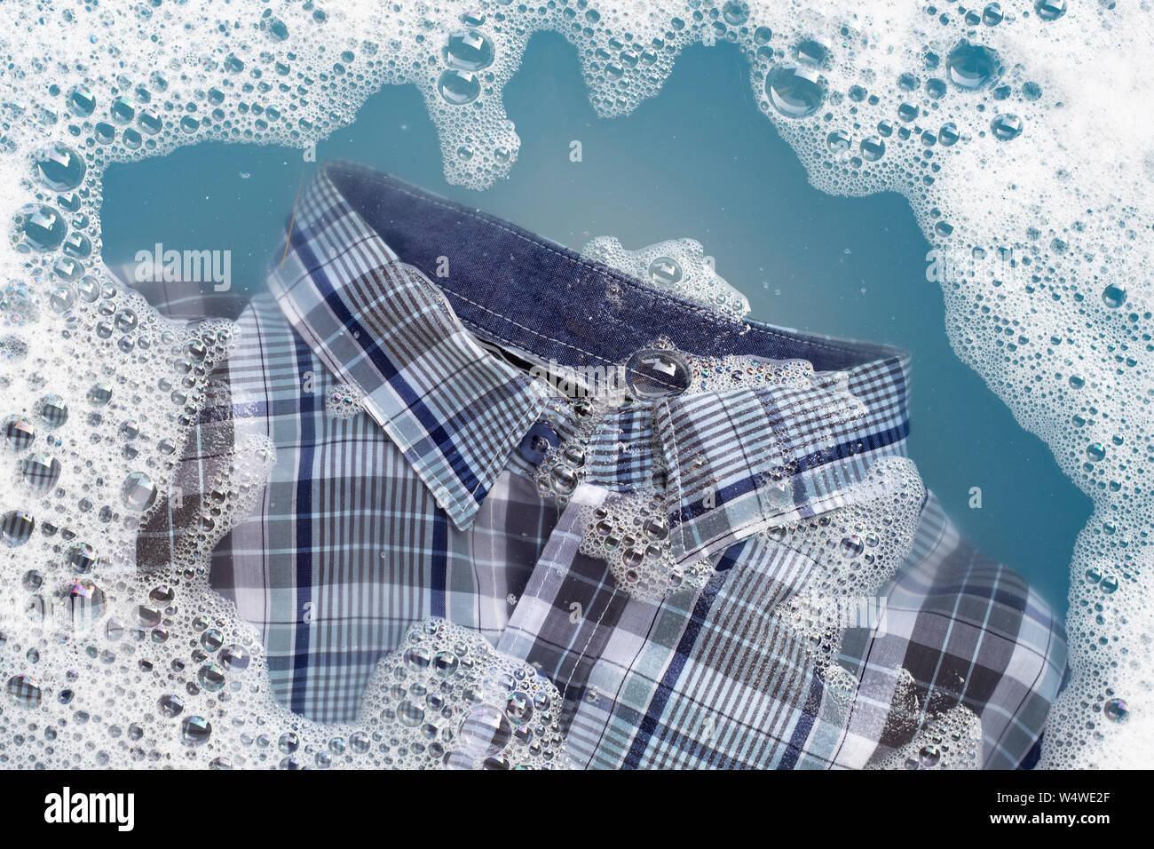 Shirt soak in powder detergent water dissolution, washing cloth ...