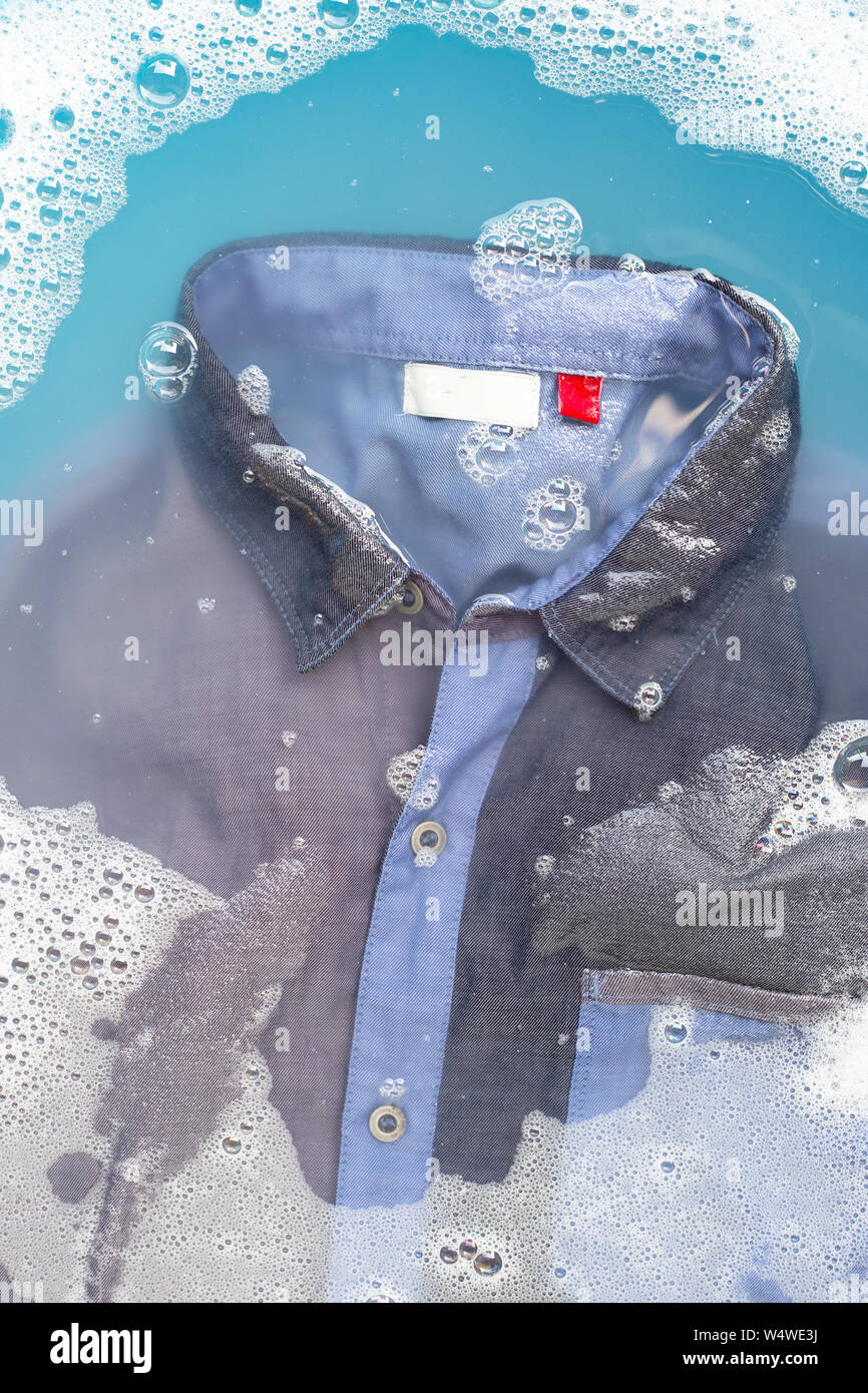 Shirt soak in powder detergent water dissolution, washing cloth ...