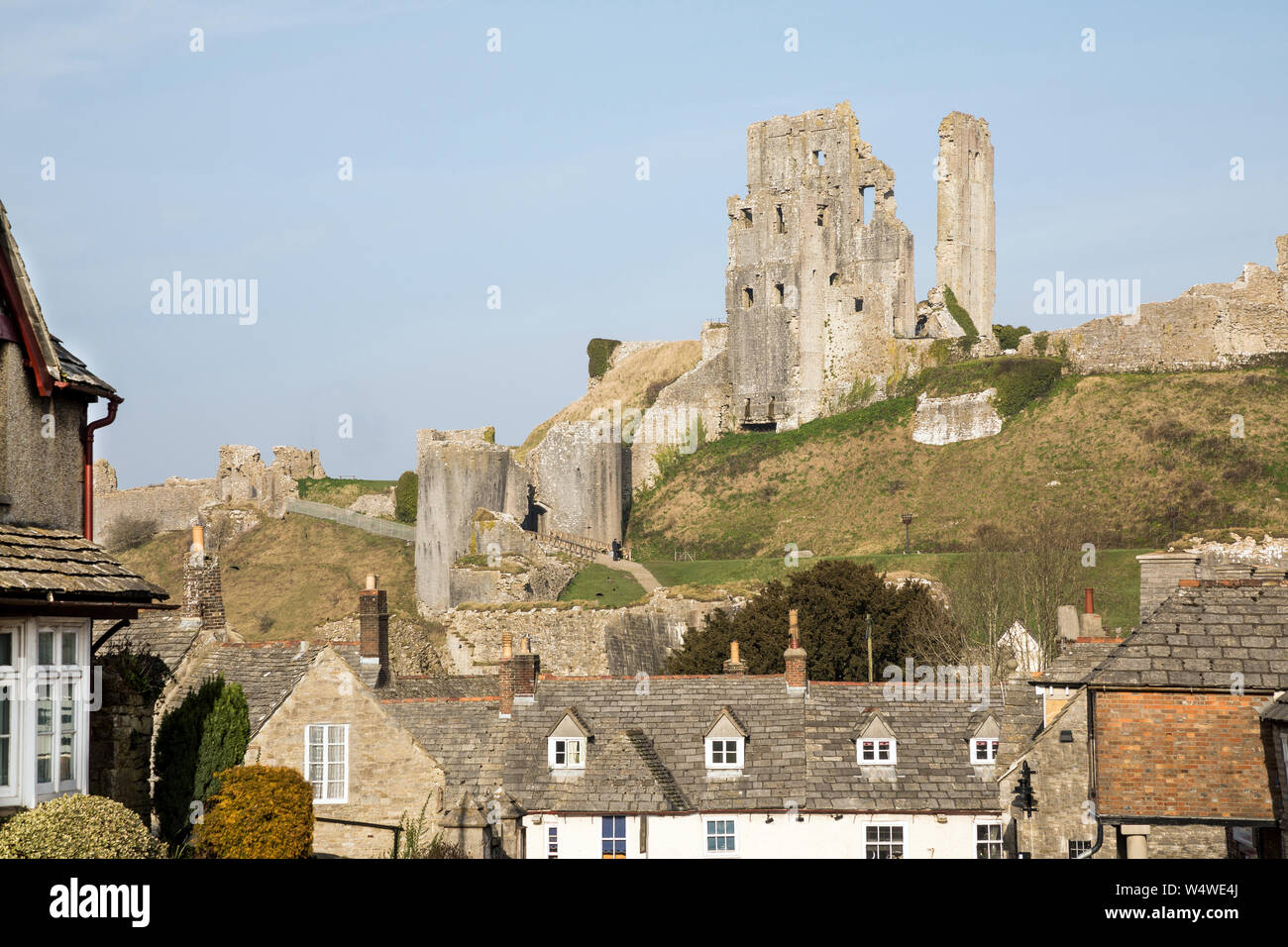 A distant view of the castle ruins rom the town of Corfe Castle. Corfe ...