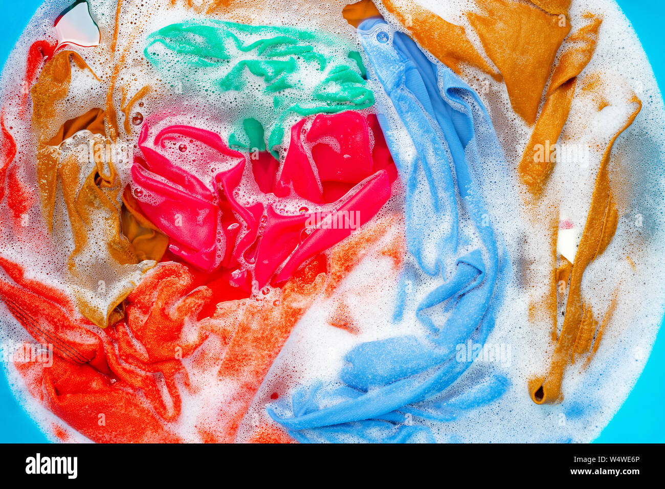 Color clothes soak before washing. Top view Stock Photo - Alamy