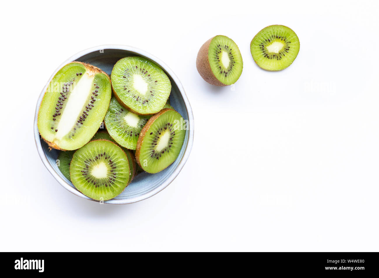 Kiwi fruit on white background. Top view Stock Photo - Alamy