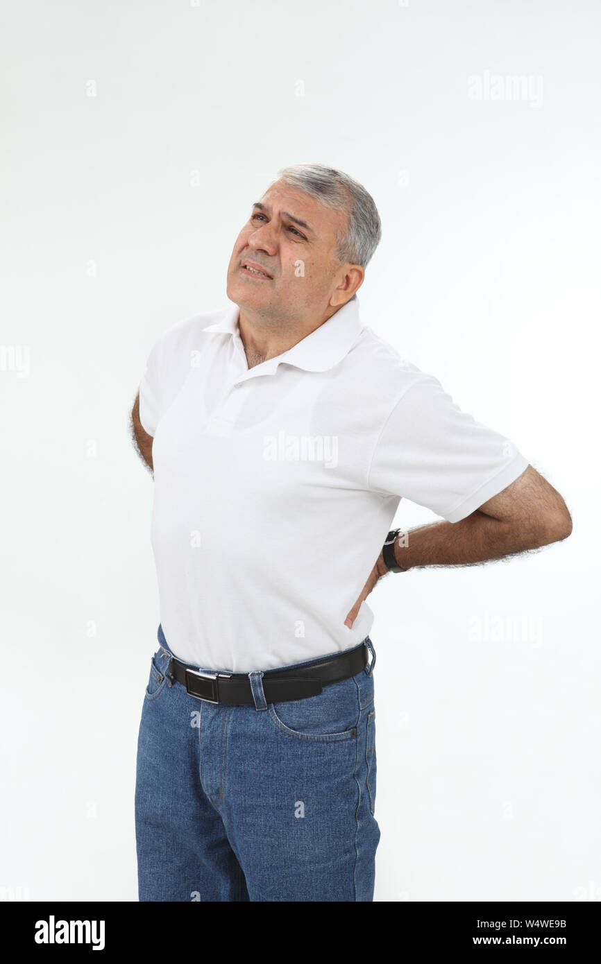 Old man suffering from lower back pain Stock Photo - Alamy