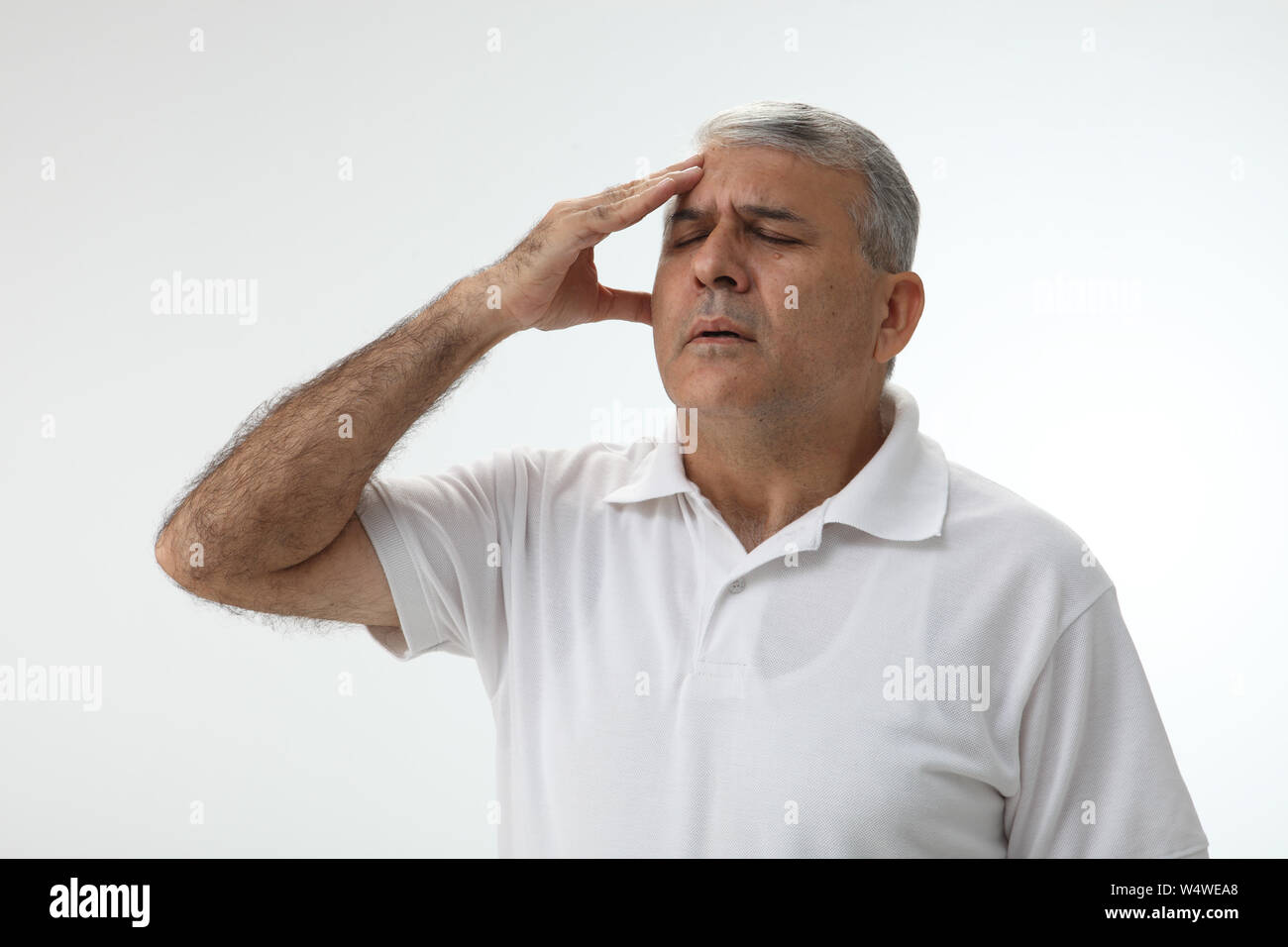 Old man suffering from headache Stock Photo - Alamy