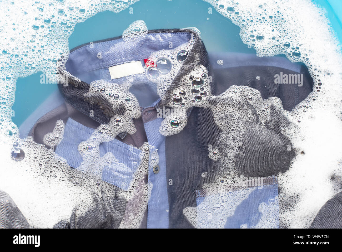 Shirt soak in powder detergent water dissolution, washing cloth ...