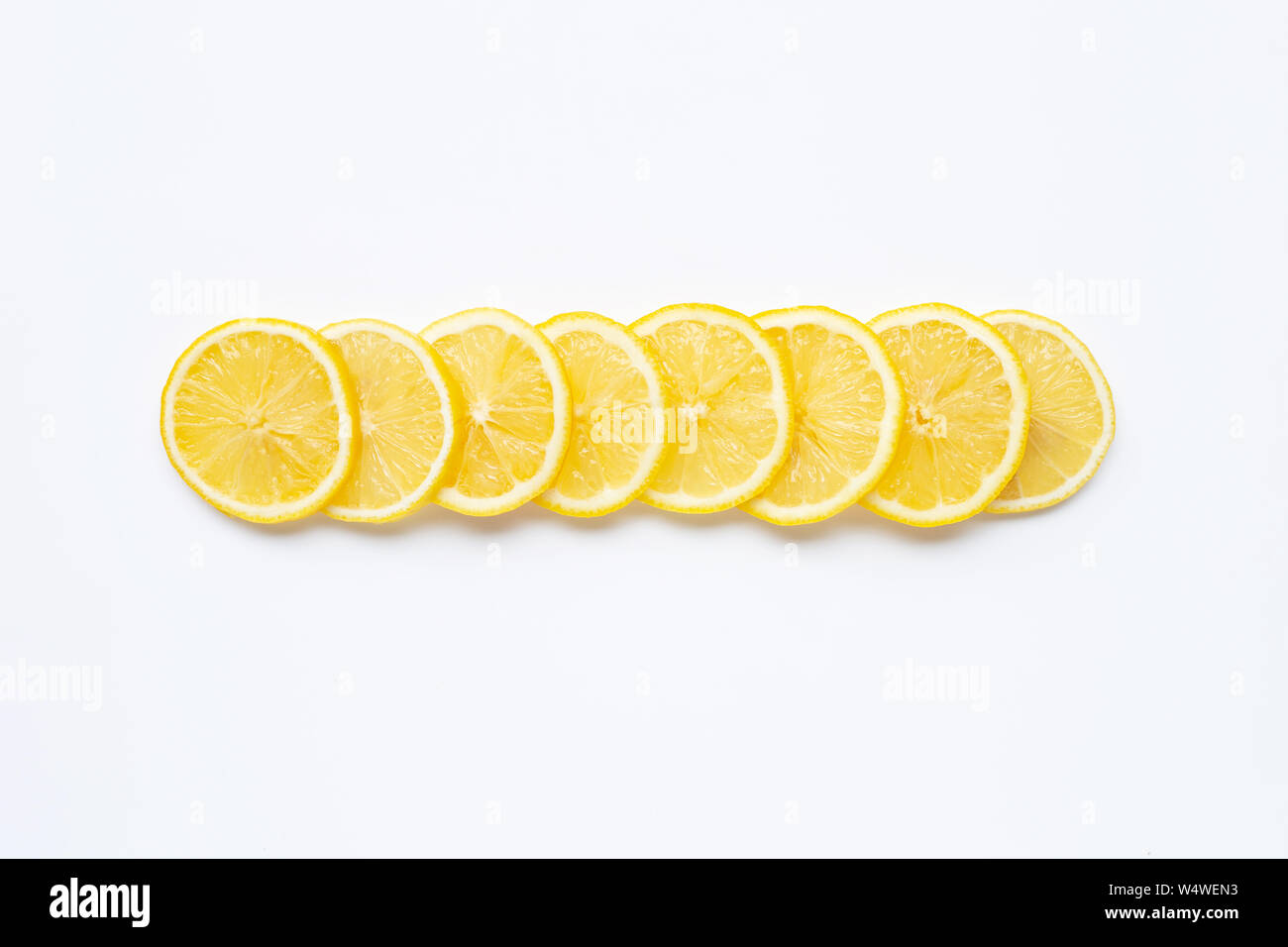 Fresh lemon slices on white background Stock Photo - Alamy