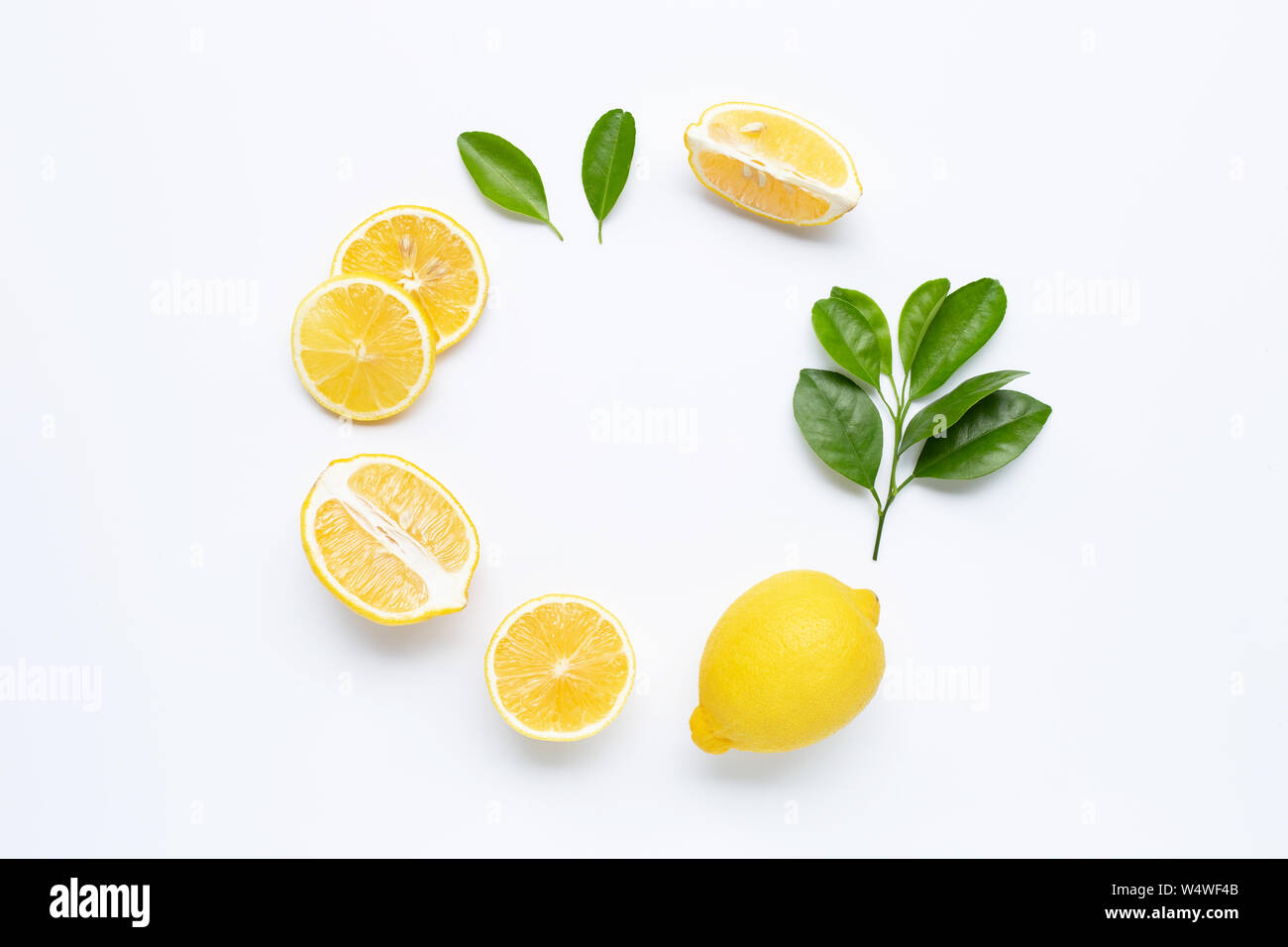 lemon and slices with leaves isolated on white background Stock Photo ...