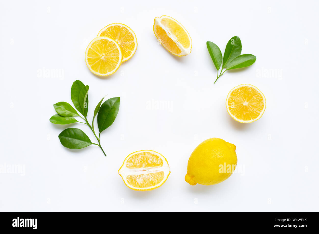 lemon and slices with leaves isolated on white background Stock Photo ...
