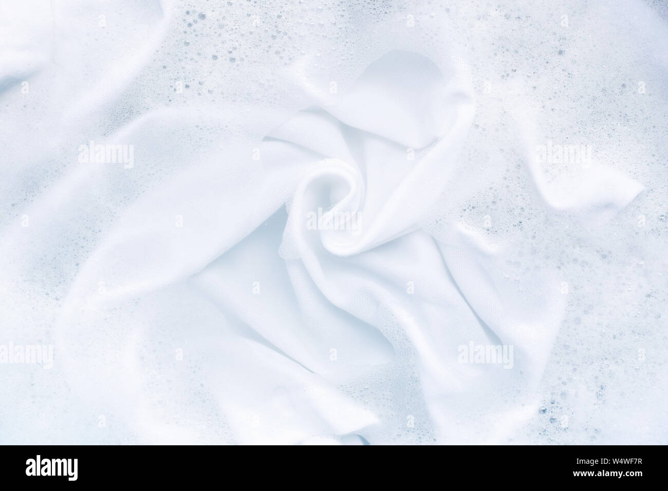 Soak a cloth before washing, white cloth. Top view Stock Photo - Alamy