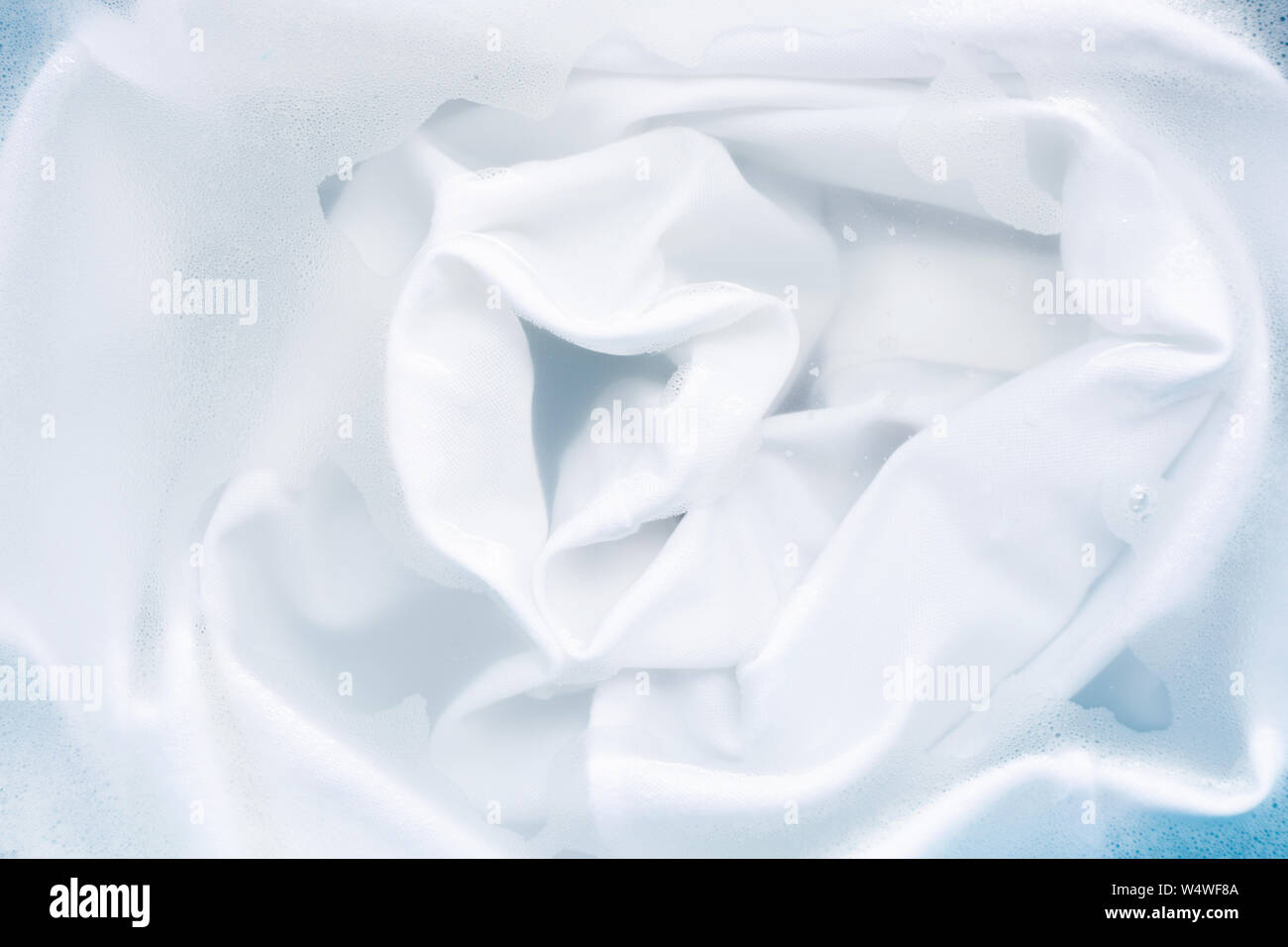 Soak a cloth before washing, white cloth. Top view Stock Photo - Alamy