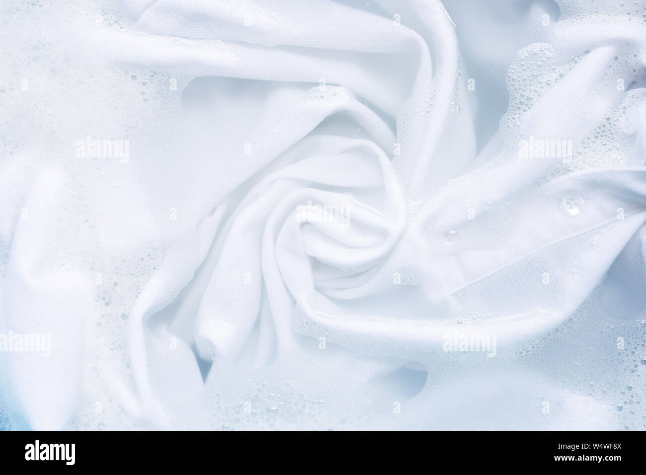 Soak a cloth before washing, white cloth. Top view Stock Photo - Alamy