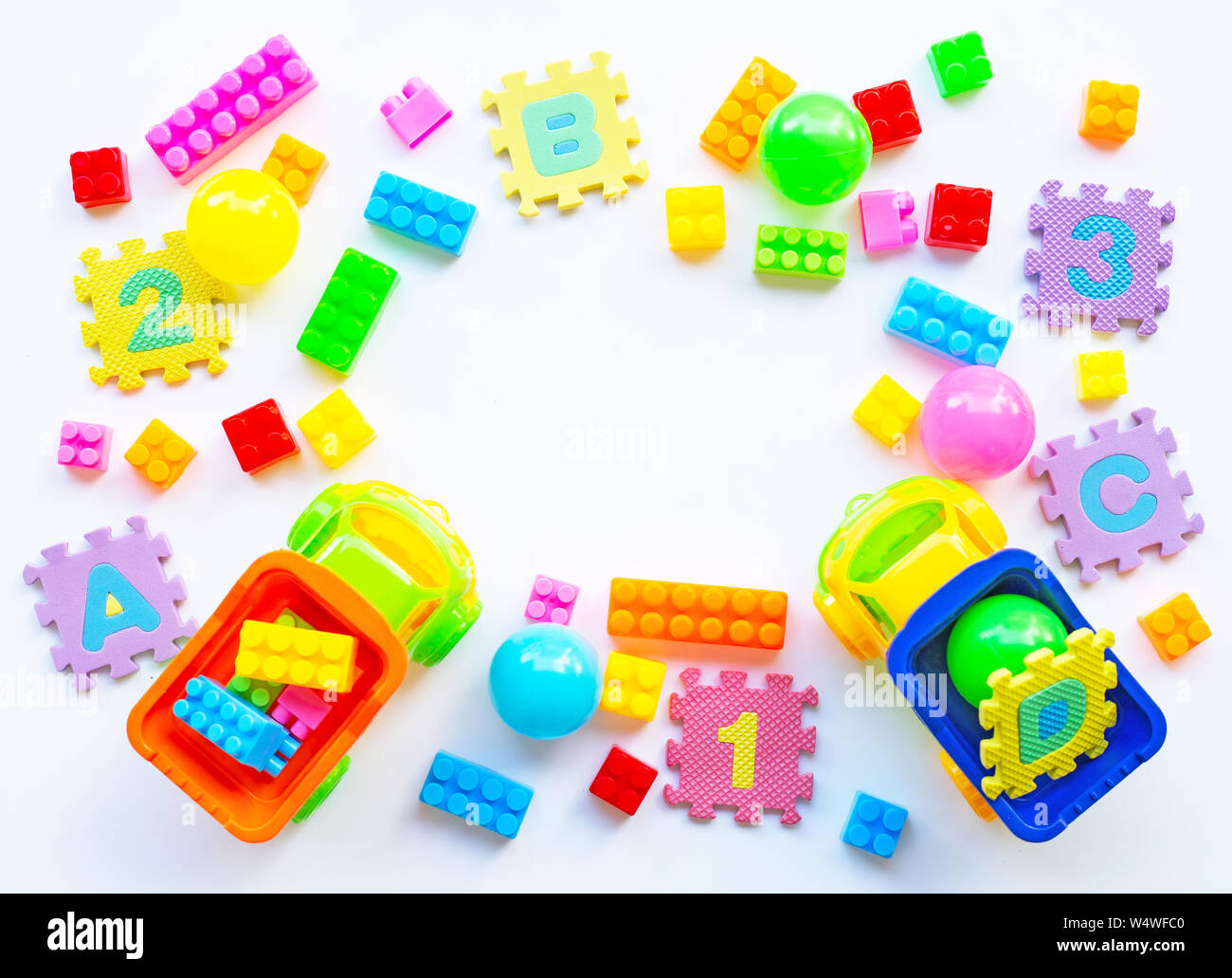 Colorful Kids toys on white background. Copy space Stock Photo - Alamy