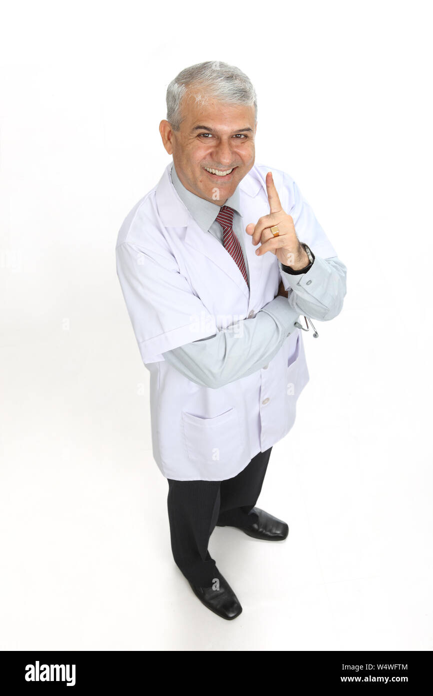 Male doctor pointing upward and smiling Stock Photo - Alamy