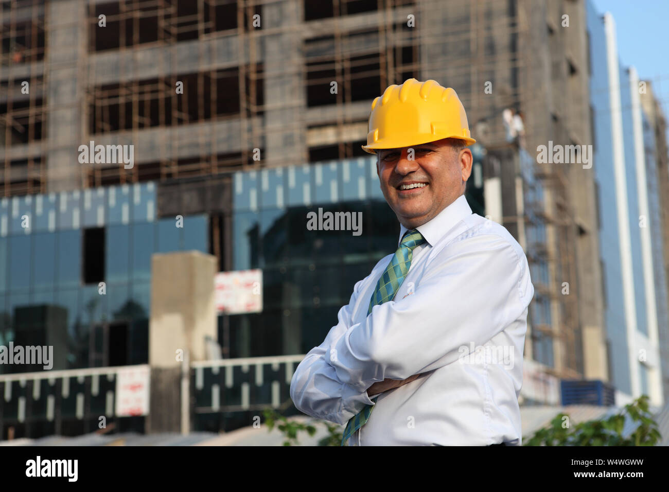 Engineer standing at a construction site Stock Photo - Alamy
