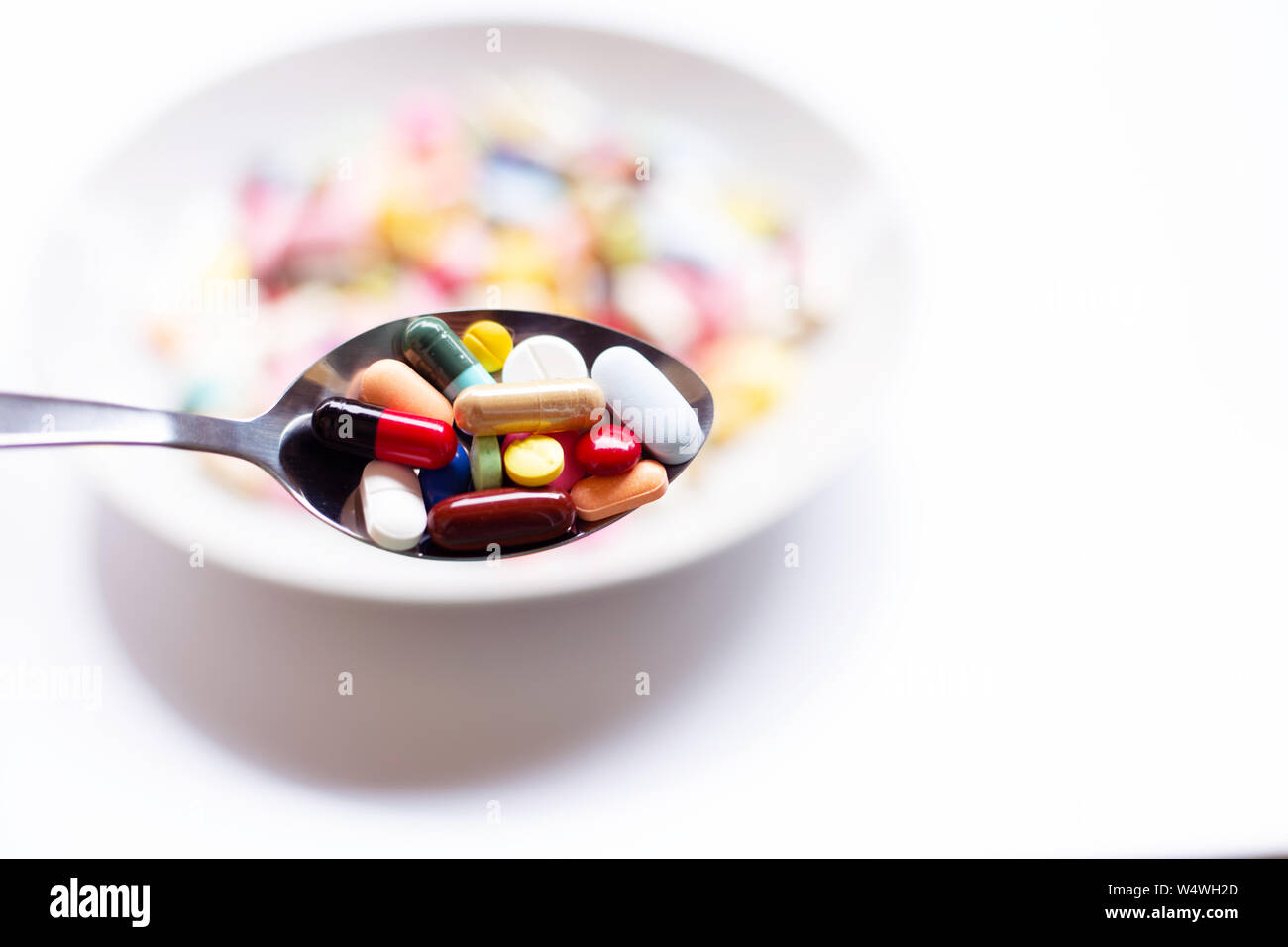 Colorful tablets with capsules and pills on white background Stock ...