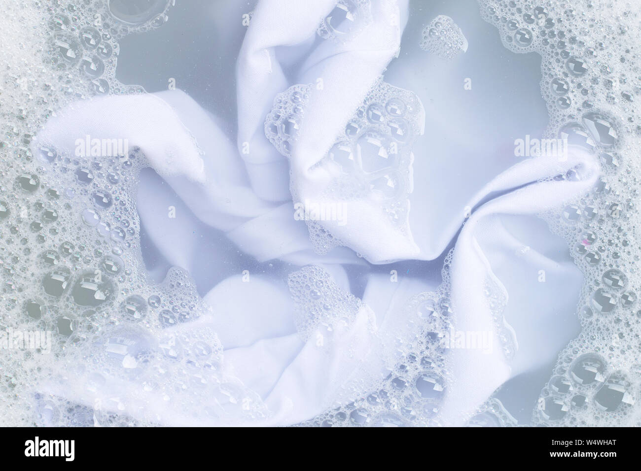 Soak a cloth before washing, white cloth. Top view Stock Photo - Alamy