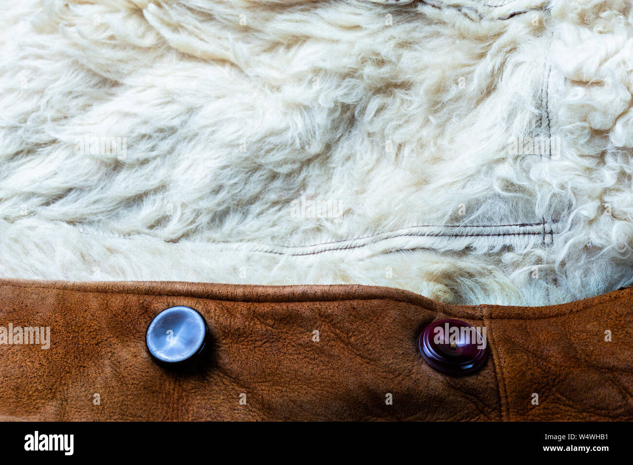 small brown thick seude jacket with white sheep fur lining closeup ...