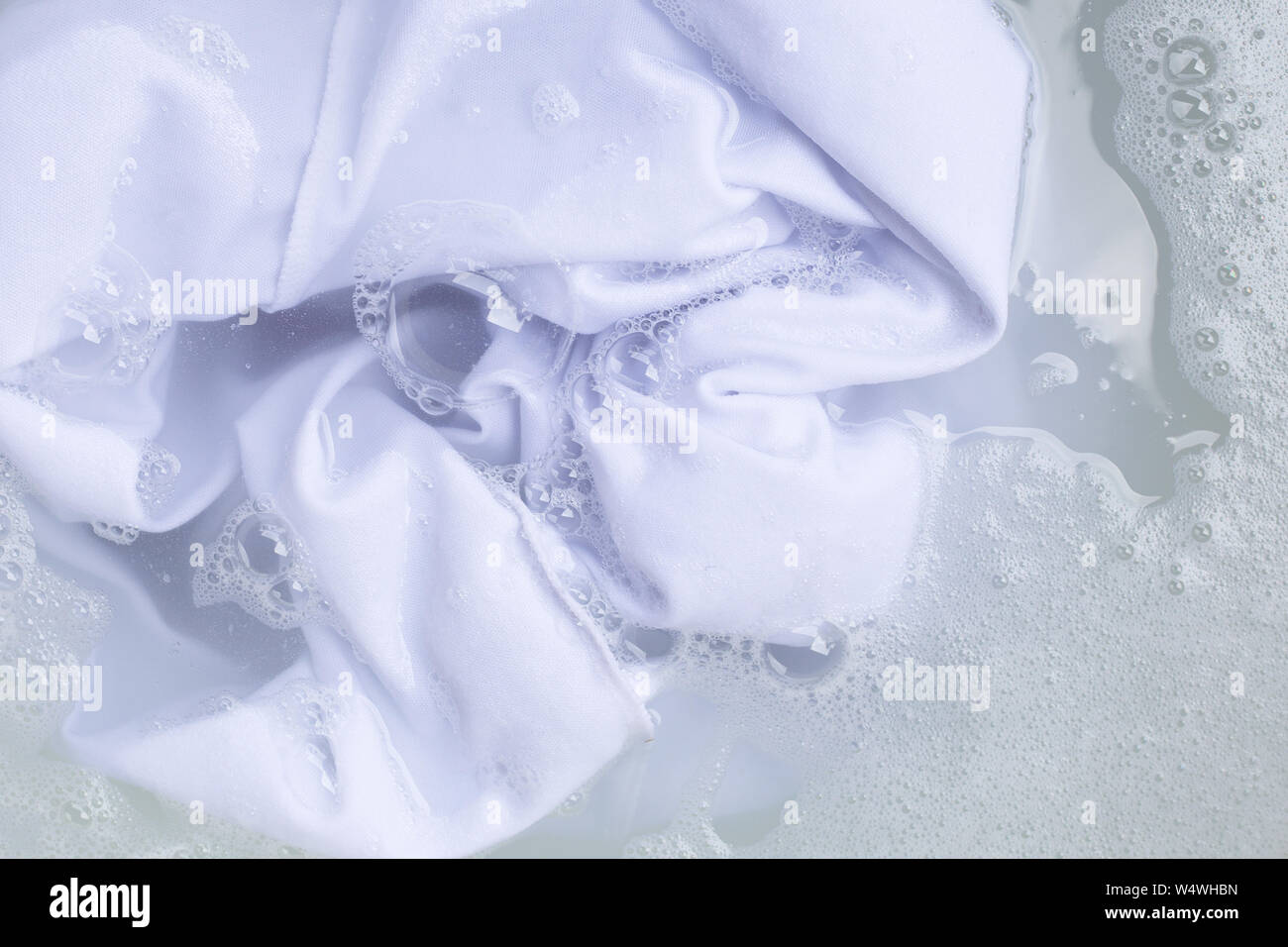 Soak a cloth before washing, white cloth. Top view Stock Photo - Alamy