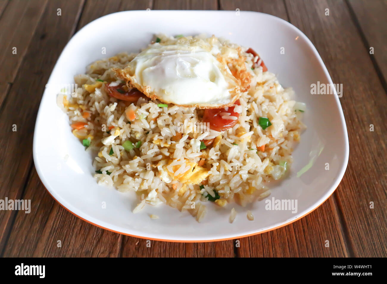 stir-fried rice with deep fried sausage ,egg and vegetable Stock Photo ...
