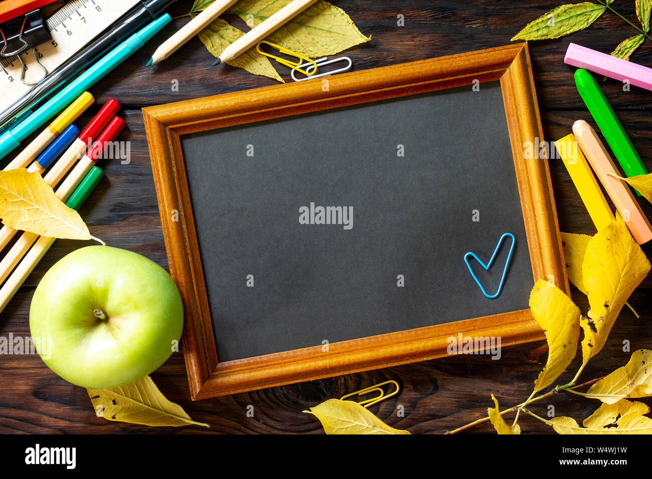 Frame Background Back to school. Table with autumn leaves, apple and ...