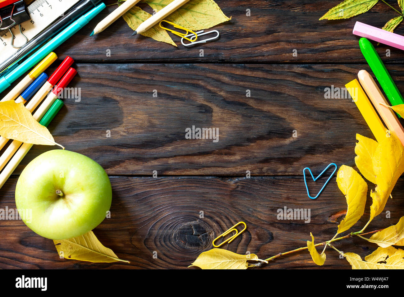 Frame Background Back to school. Table with autumn leaves, apple and ...