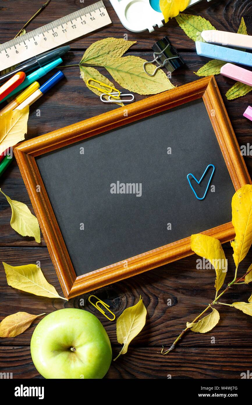 Frame Background Back to school. Table with autumn leaves, note pad ...