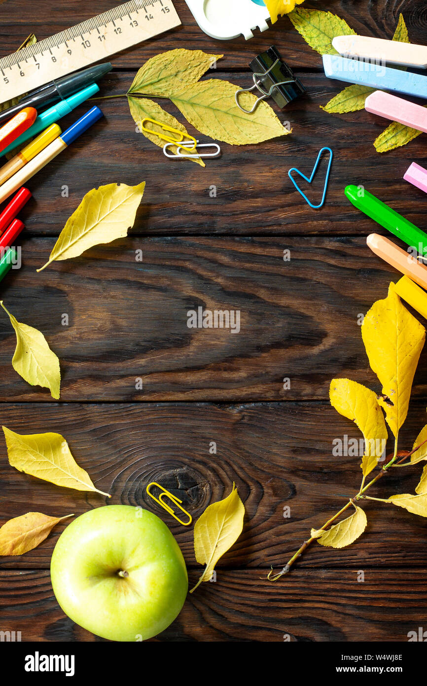 Frame Background Back to school. Table with autumn leaves, apple and ...
