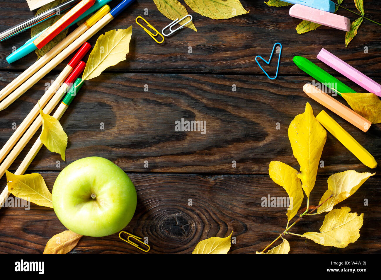 Frame Background Back to school. Table with autumn leaves, apple and ...