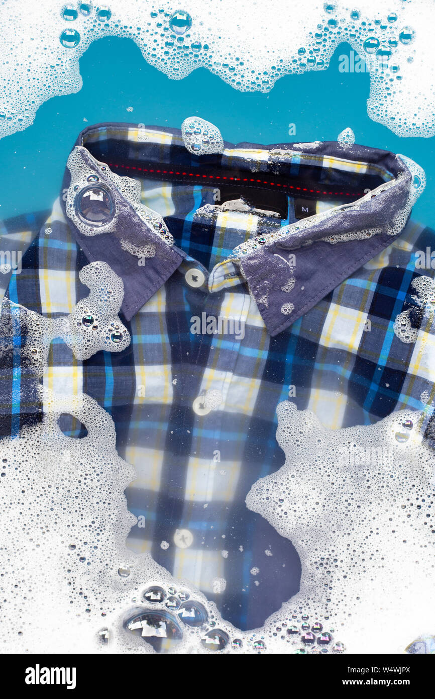 Shirt soak in powder detergent water dissolution, washing cloth ...