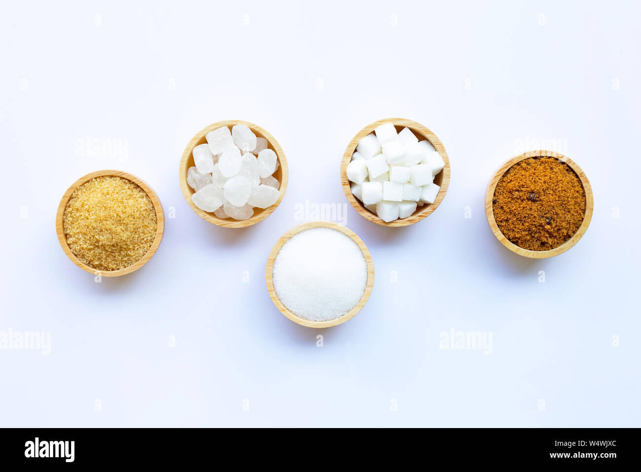 Various types of sugar on white background Stock Photo - Alamy