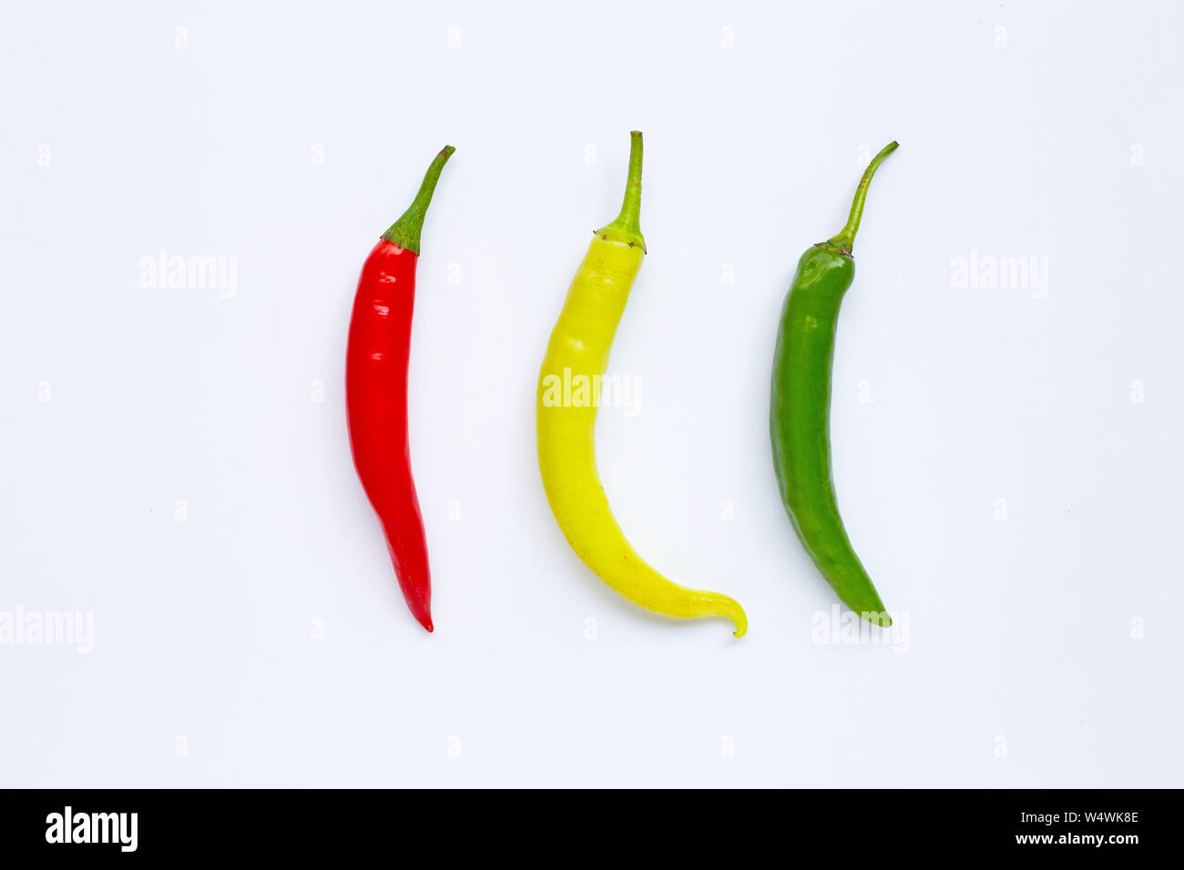 Different colors chili peppers isolated on white background Stock Photo ...