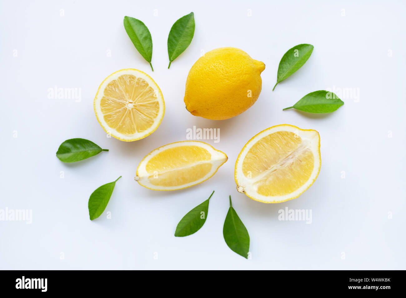 lemon and slices with leaves isolated on white background Stock Photo ...